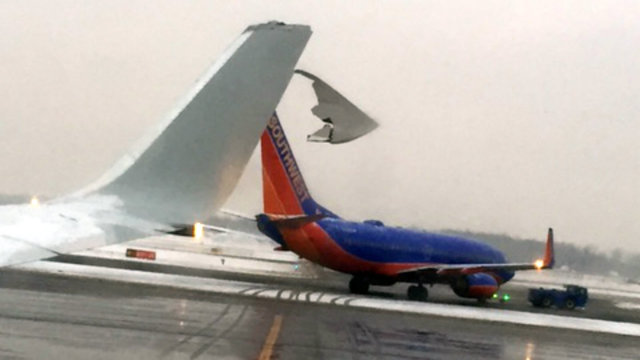 Plane's wing damaged after hitting other plane at Detroit...
