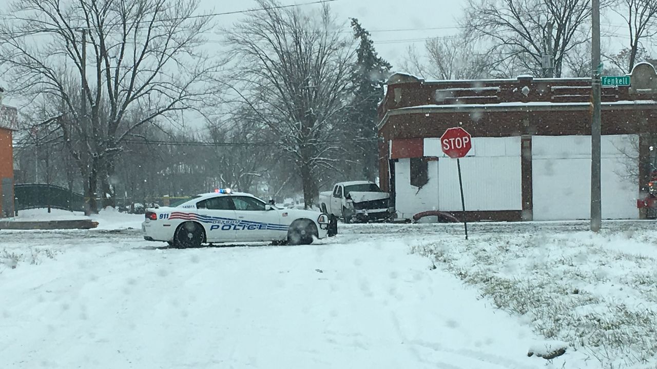 Truck hits utility pole, vacant building on Fenkell Ave.